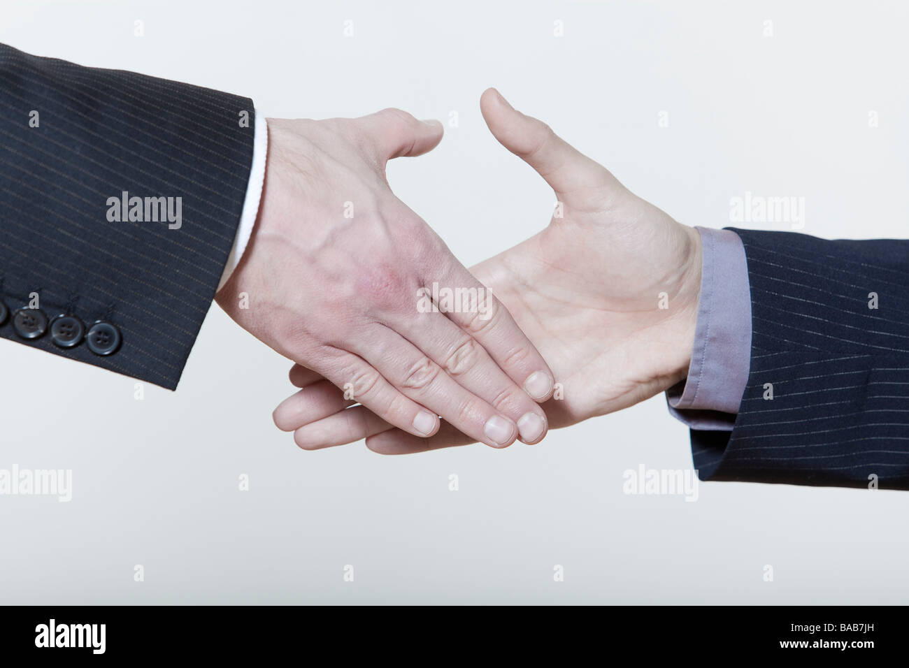 two men handshake close-up on studio isolated white background Stock ...