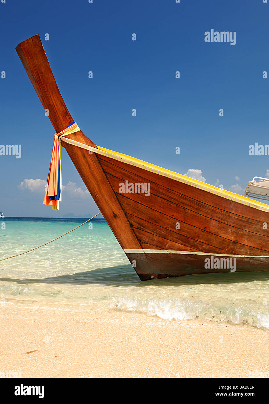 Longtail boat on a tropical island Stock Photo - Alamy