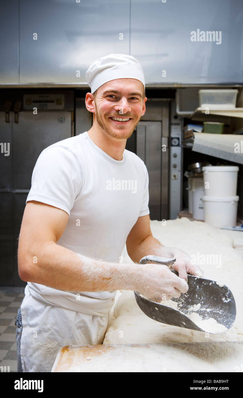 A smiling baker in a bakery Sweden Stock Photo - Alamy
