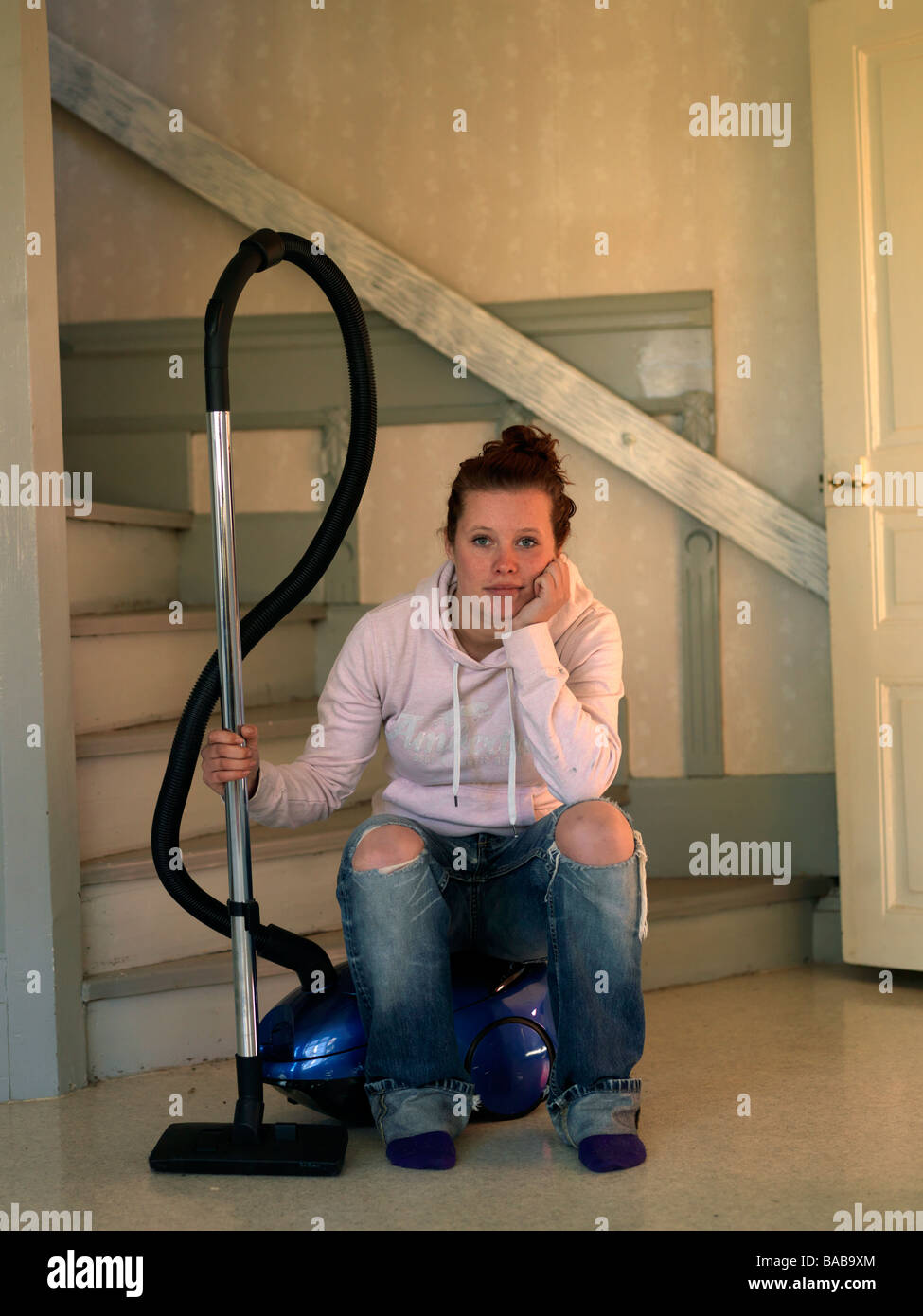 A young Scandinavian woman with a vacuum cleaner Sweden Stock Photo - Alamy