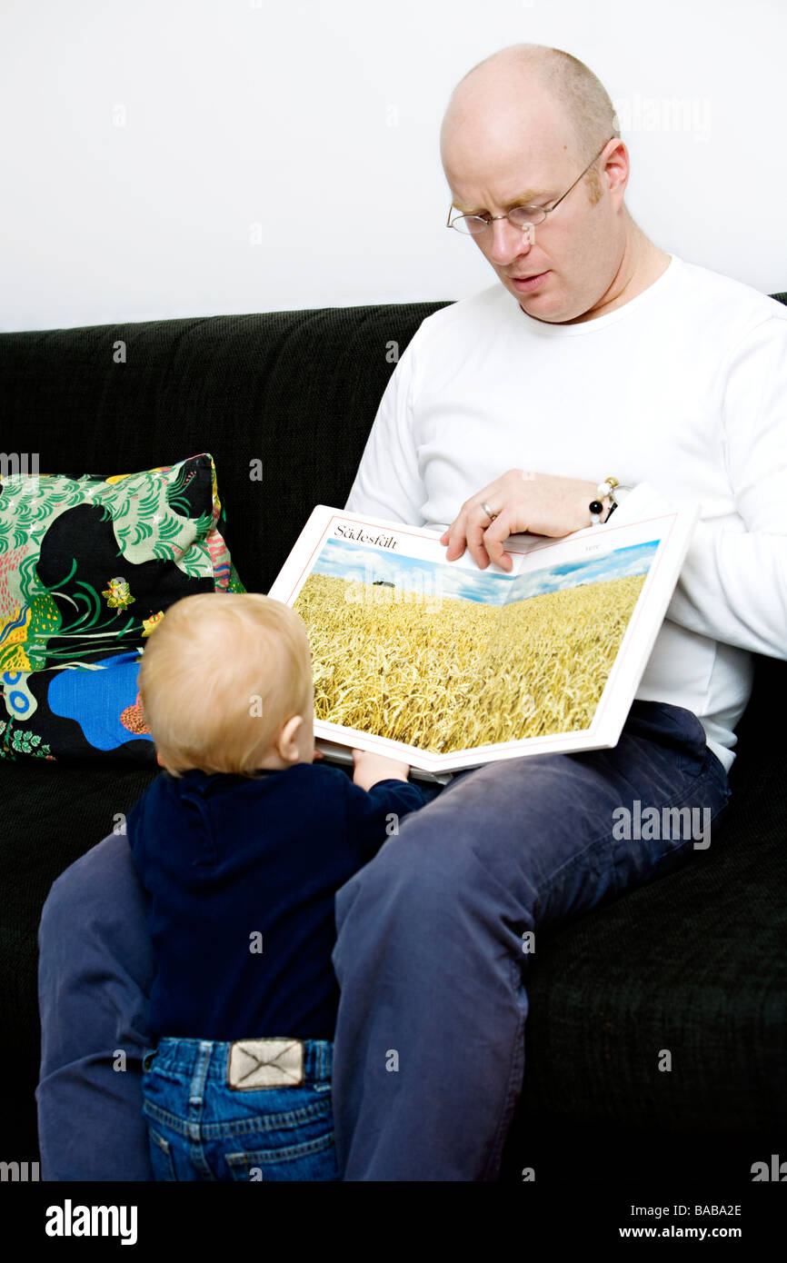 Father reading a book to his child Sweden Stock Photo - Alamy