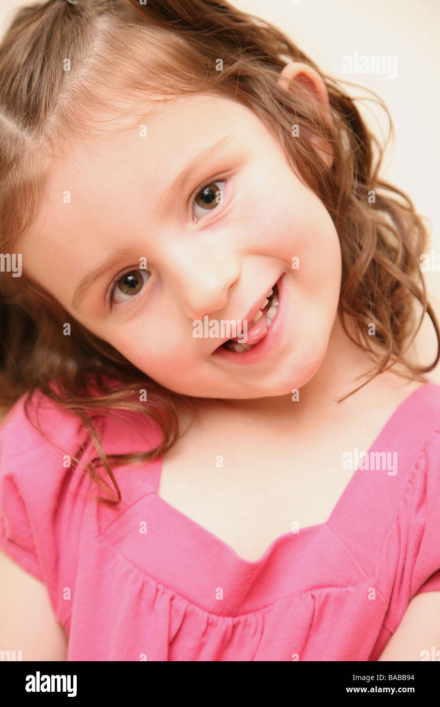 Pretty 4 year old girl posing for the camera Stock Photo - Alamy