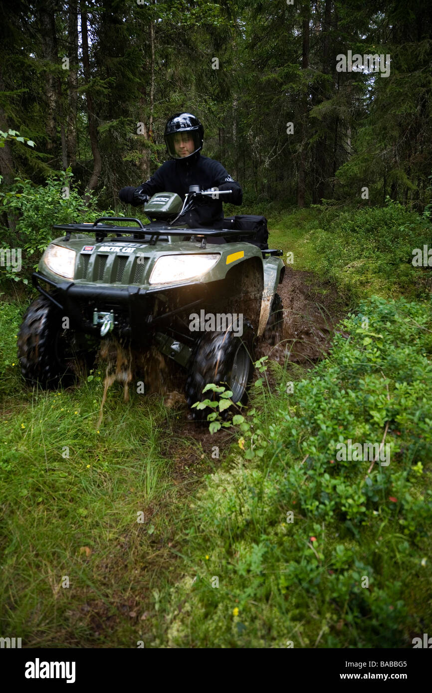 Four-wheeler in a forest Sweden Stock Photo - Alamy