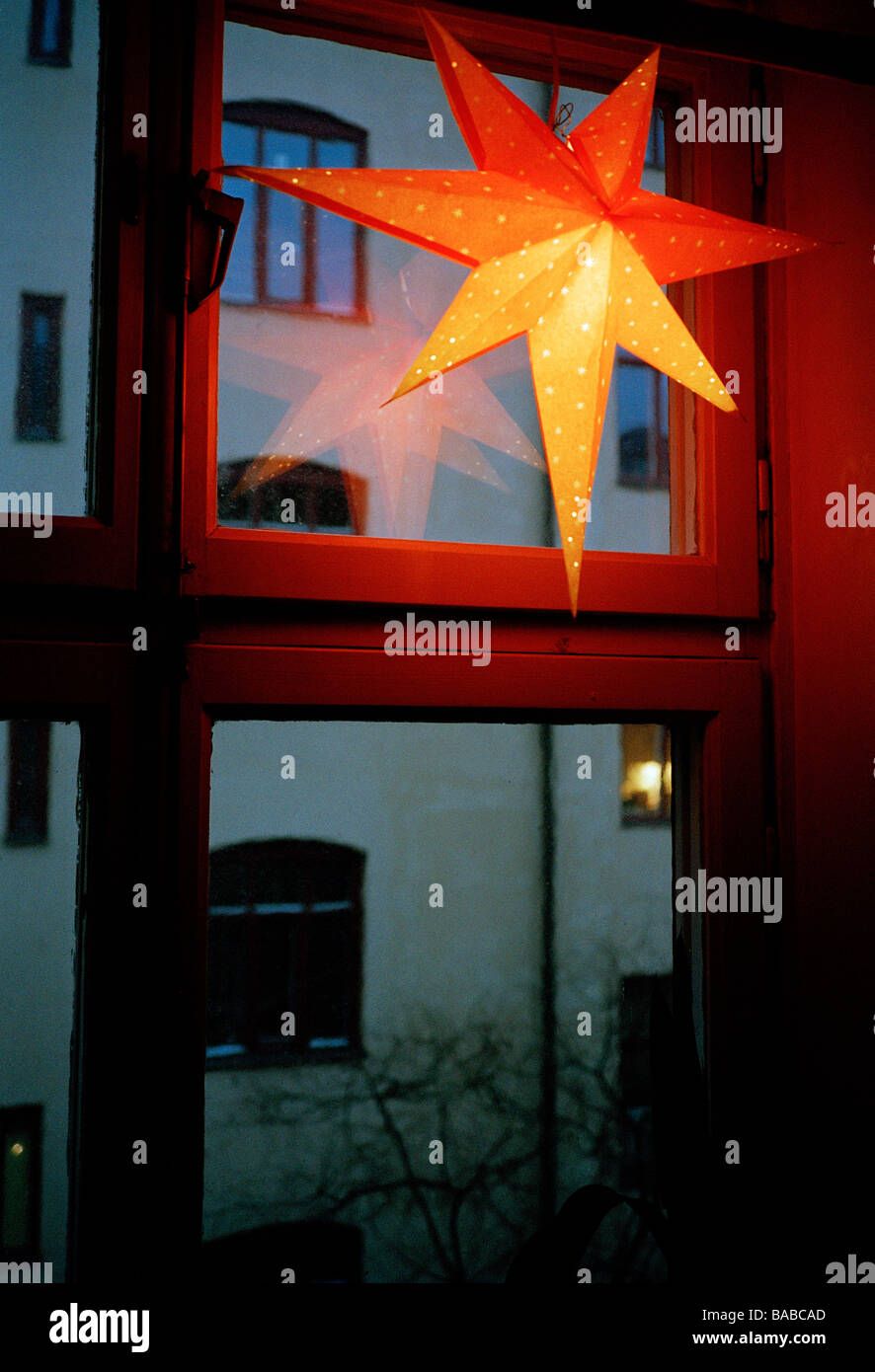 An advent star hanging in a window Sweden Stock Photo - Alamy