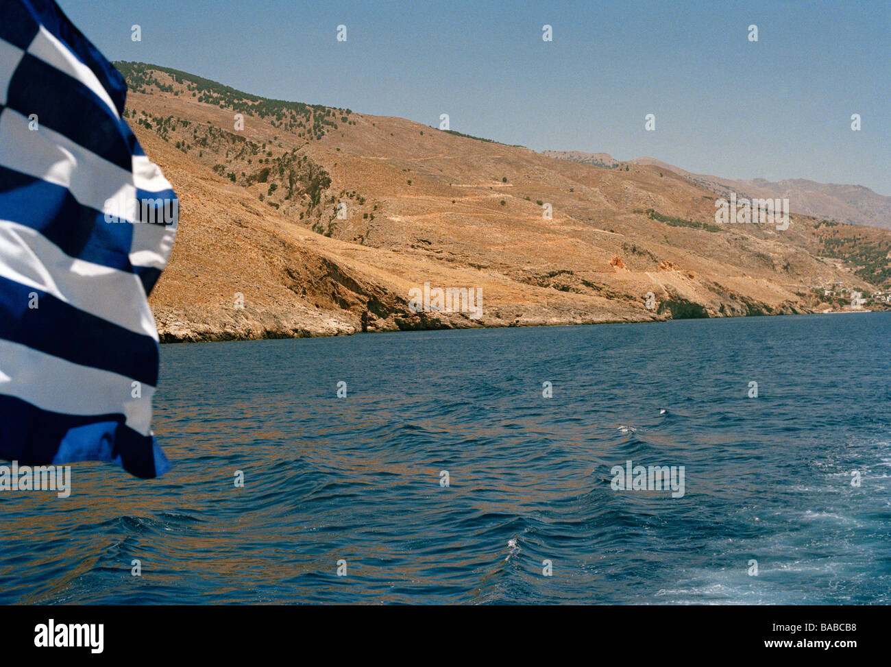 A greec flag over the ocean Greece Stock Photo - Alamy