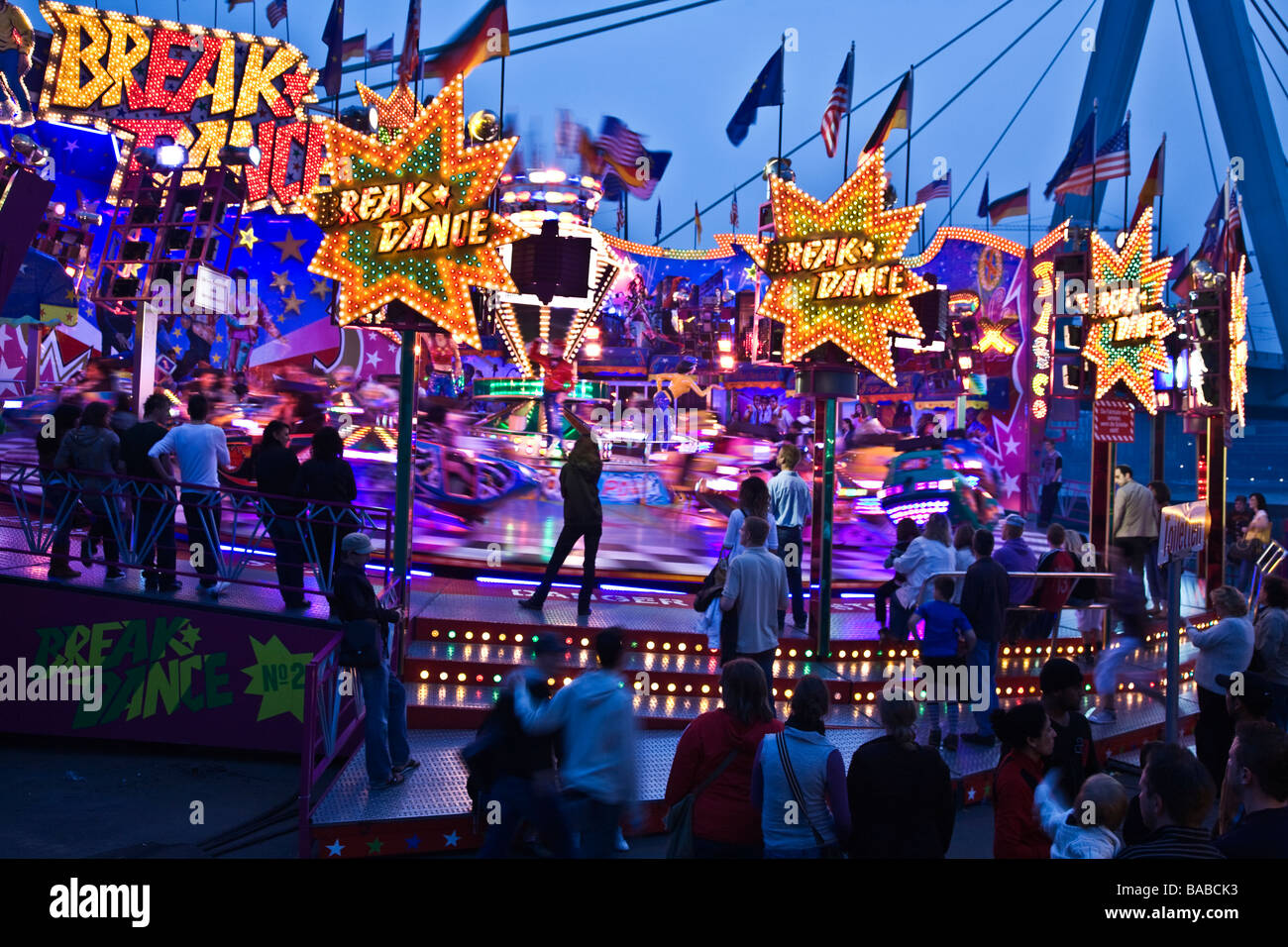 Waltzer ride at funfair at night in Cologne Stock Photo - Alamy