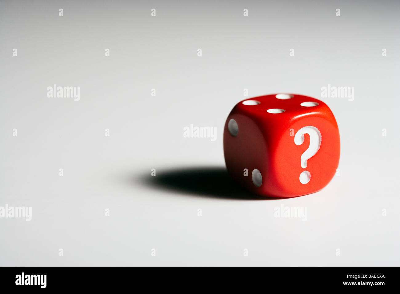 A red dice against white background Stock Photo - Alamy