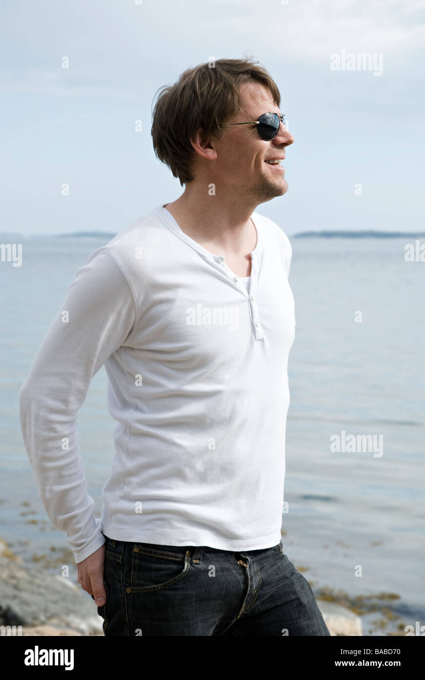 A smiling man by the sea Sweden Stock Photo - Alamy