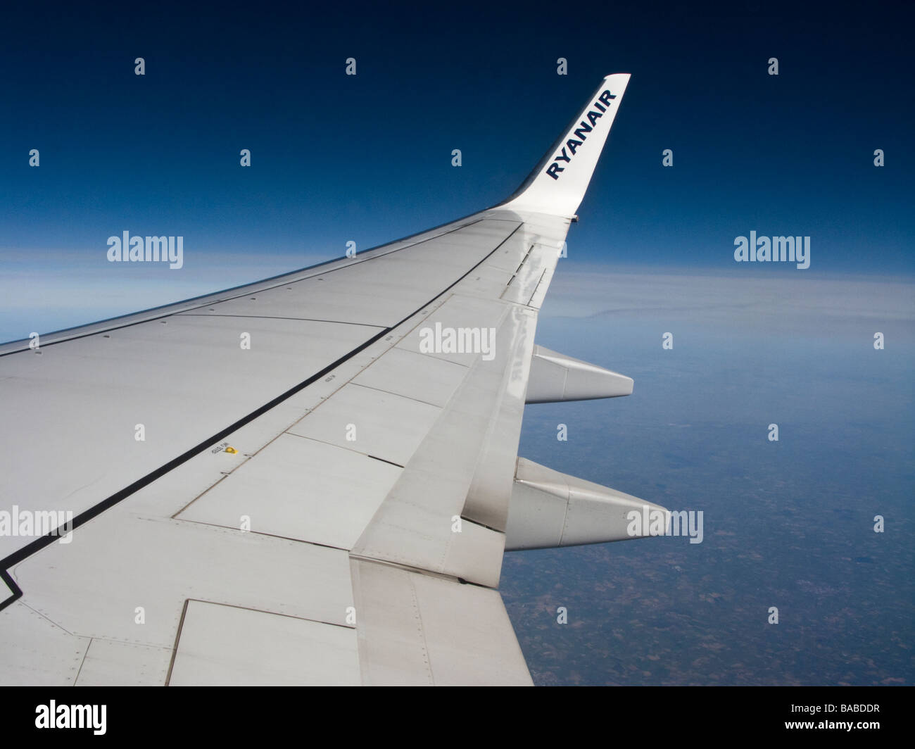 Starboard wing of a Boeing 737-800 aircraft in flight. Operated by Ryan ...