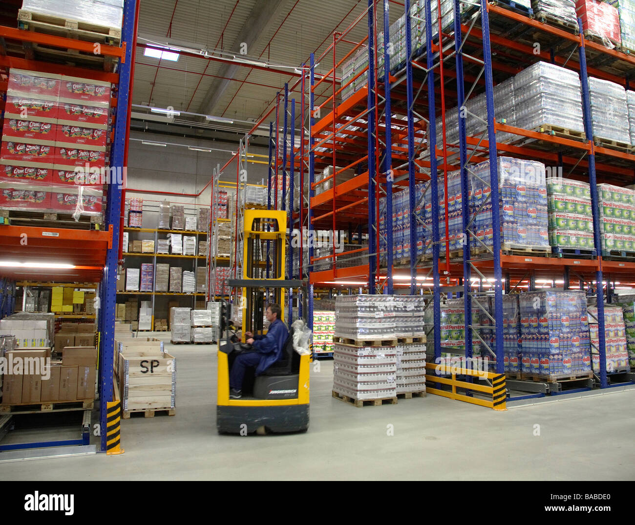 Warehouseman operating a forklift in a high rack warehouse, Hamm ...