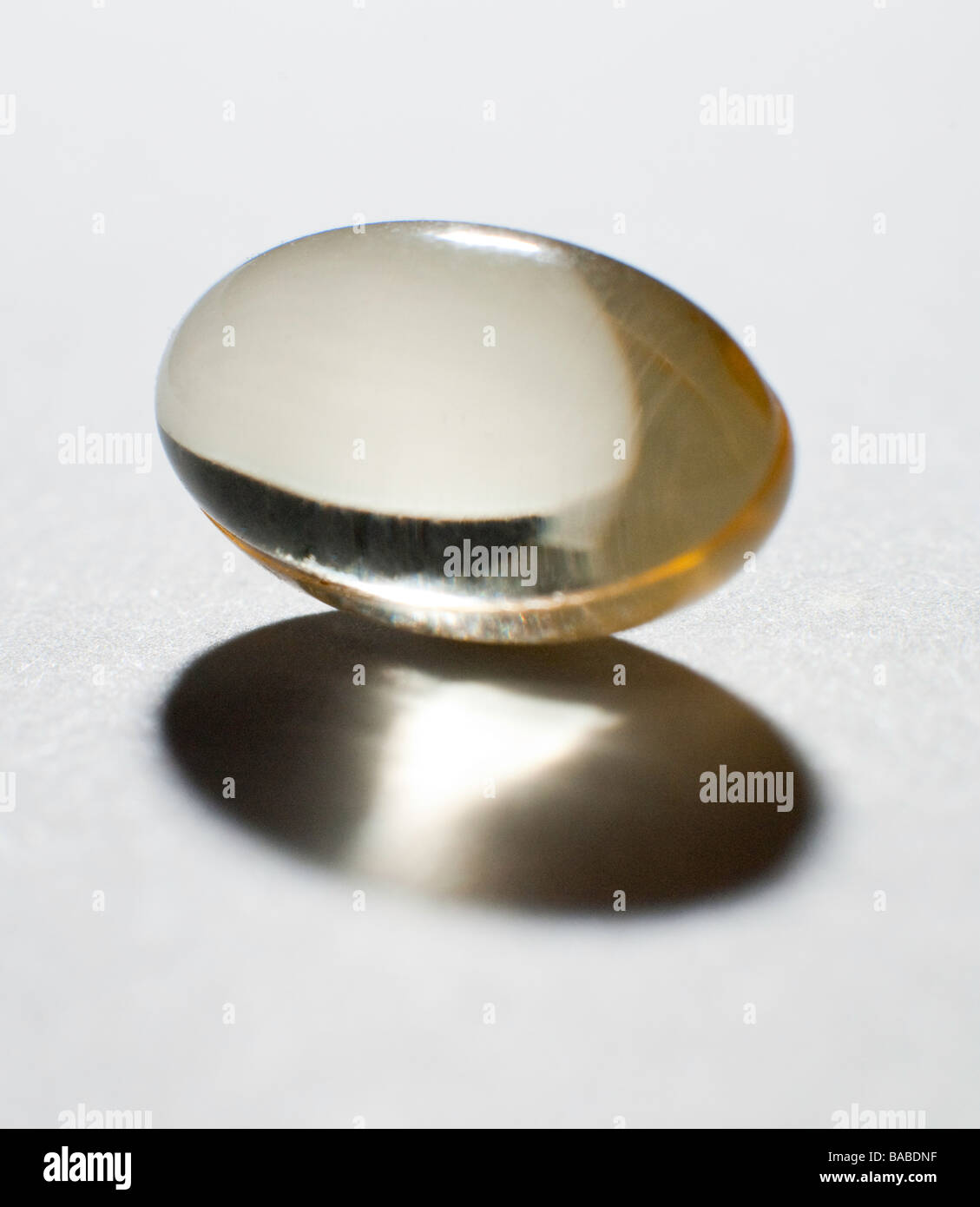 Backlit Vitamin E gel capsule Stock Photo - Alamy