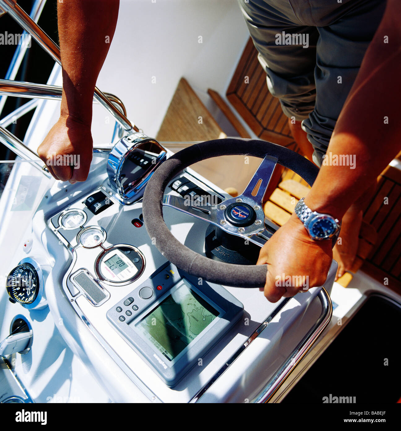 A man steering a boat Sweden Stock Photo - Alamy