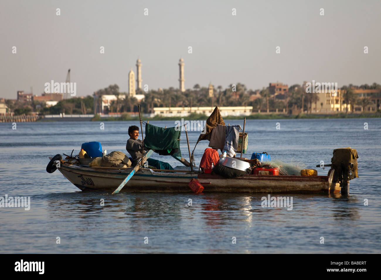 fisherman rowing his fishing boat on the Nile river at Cairo, Egypt ...