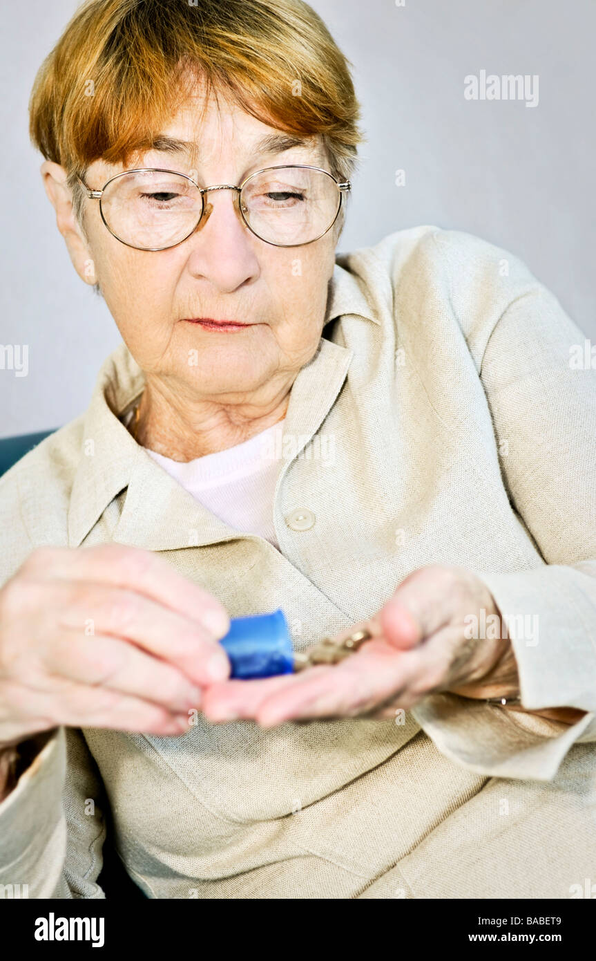 Capsules pouring from bottle container hi-res stock photography and ...
