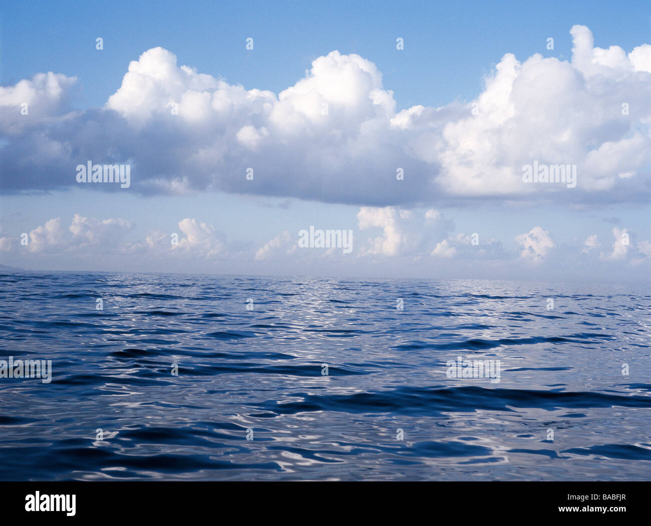 Blue ocean blue sky and white clouds Bali Indonesia Stock Photo - Alamy