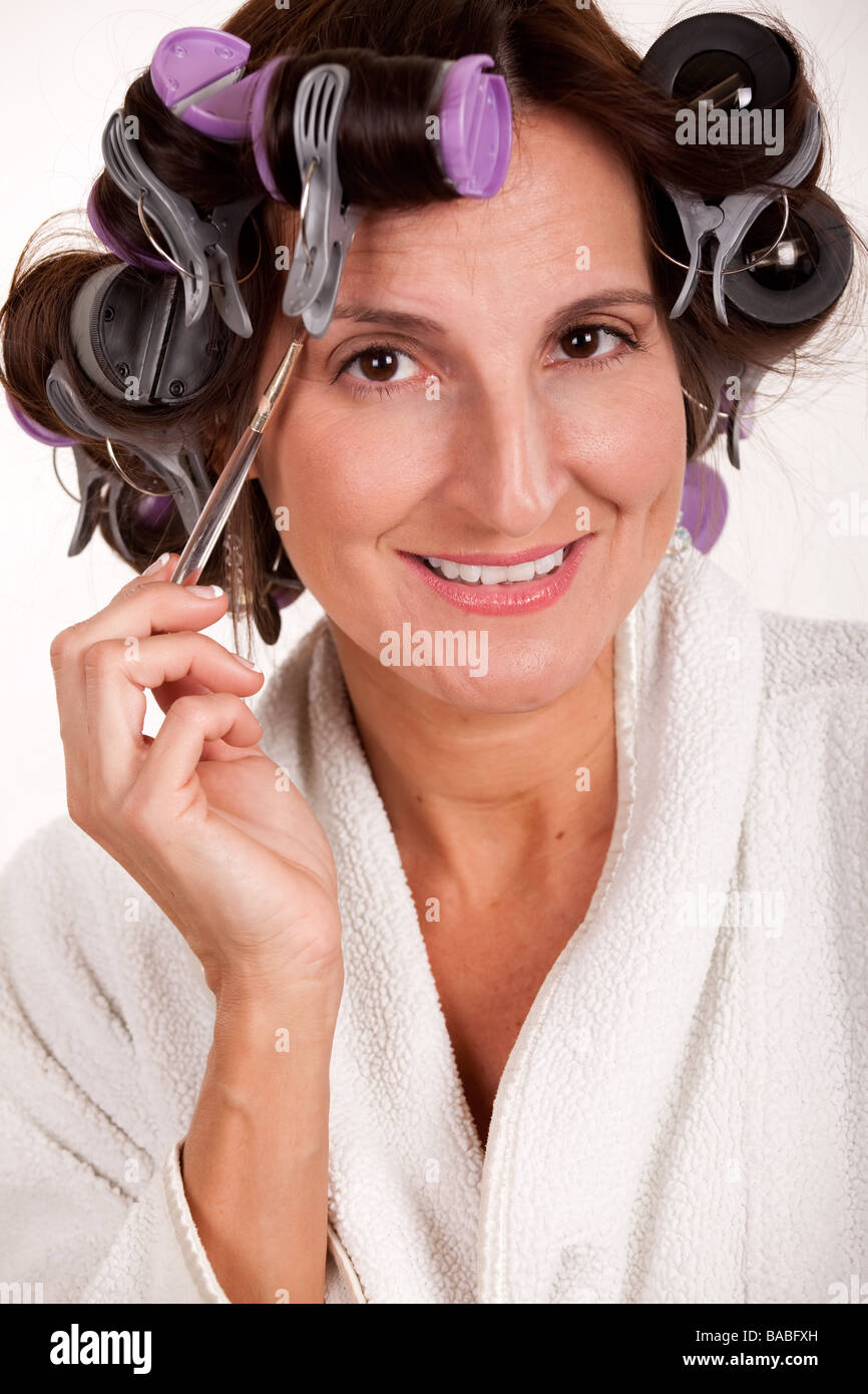 Woman in hair curlers Stock Photo - Alamy