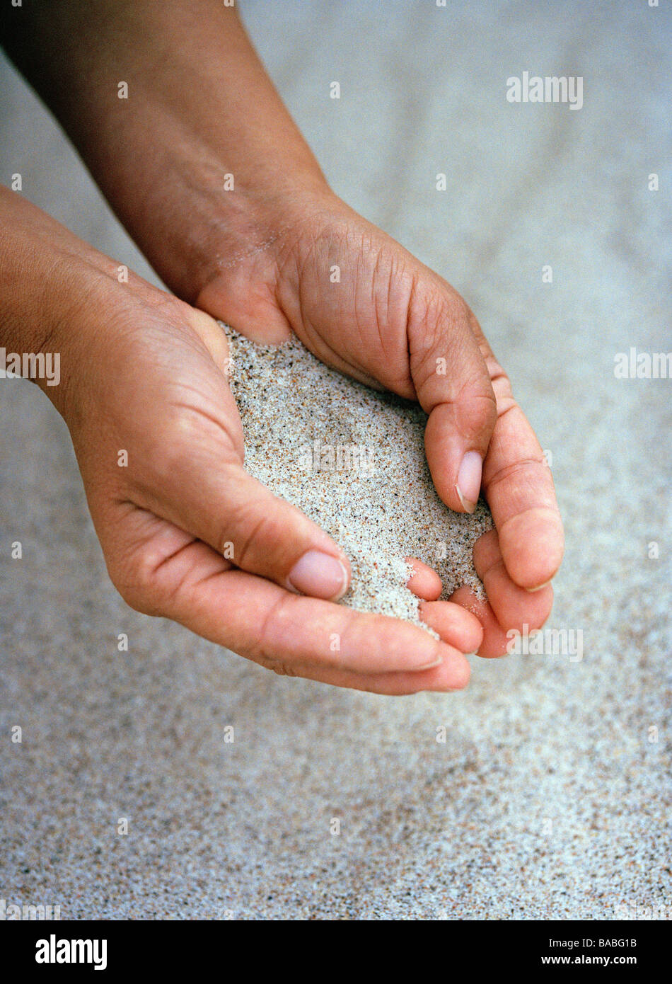 Hands holding sand Sweden Stock Photo - Alamy