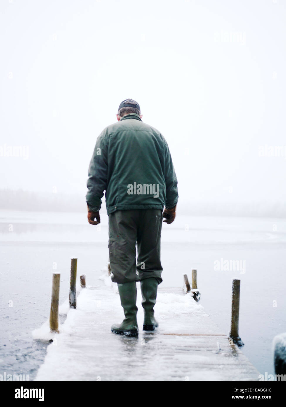 Rear man walking on jetty hi-res stock photography and images - Alamy