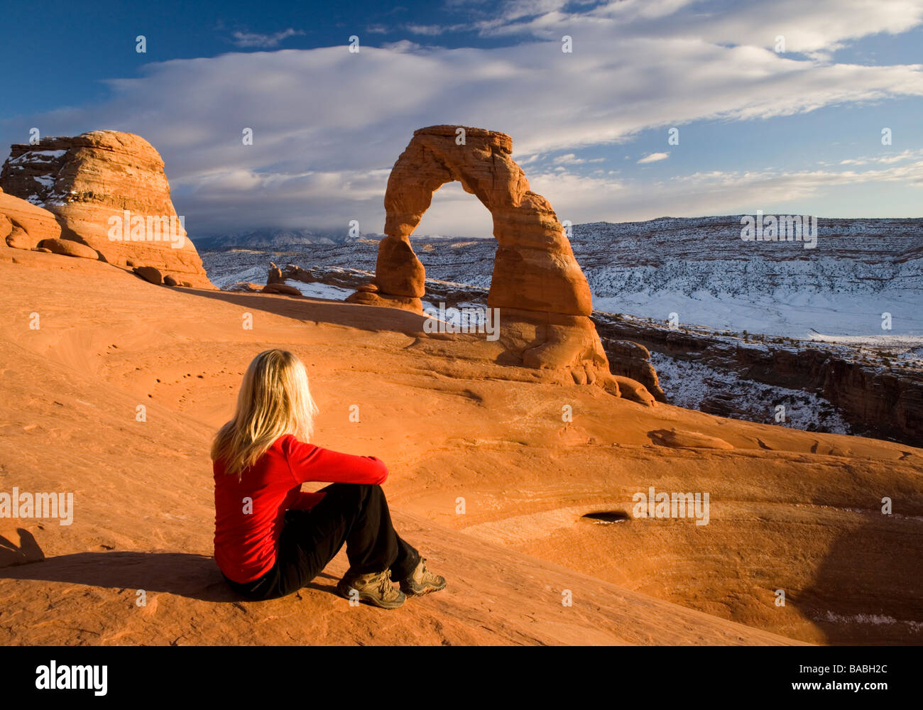 Girl viewing Delicate arch at sunset in Arches National Park, Utah, USA ...