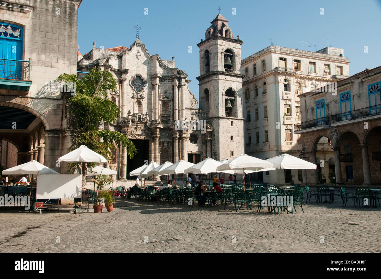 Cathedral Square in Old Havana with arched columns, a church with bell ...