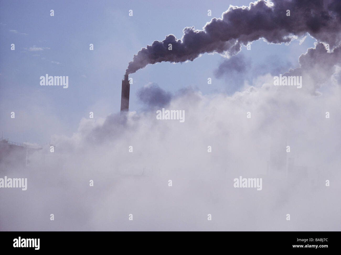 Chimney emitting smoke Stock Photo - Alamy