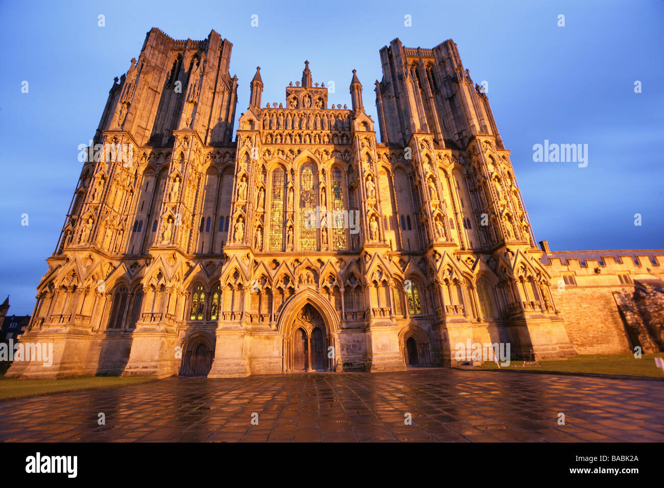 City of Wells, England. Rainy night view of the West Front and Nave ...