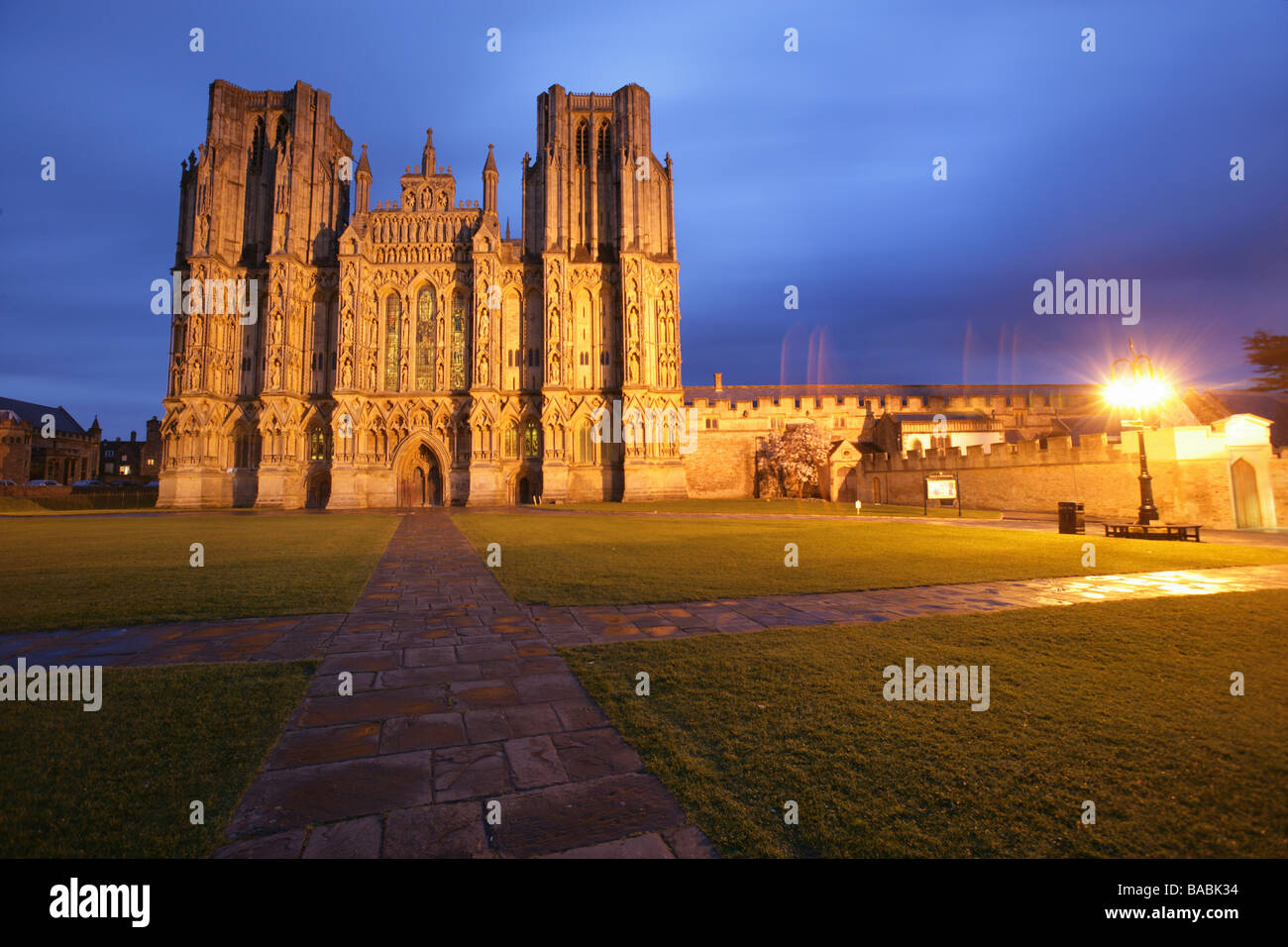 City of Wells, England. Rainy night view of the West Front and Nave ...