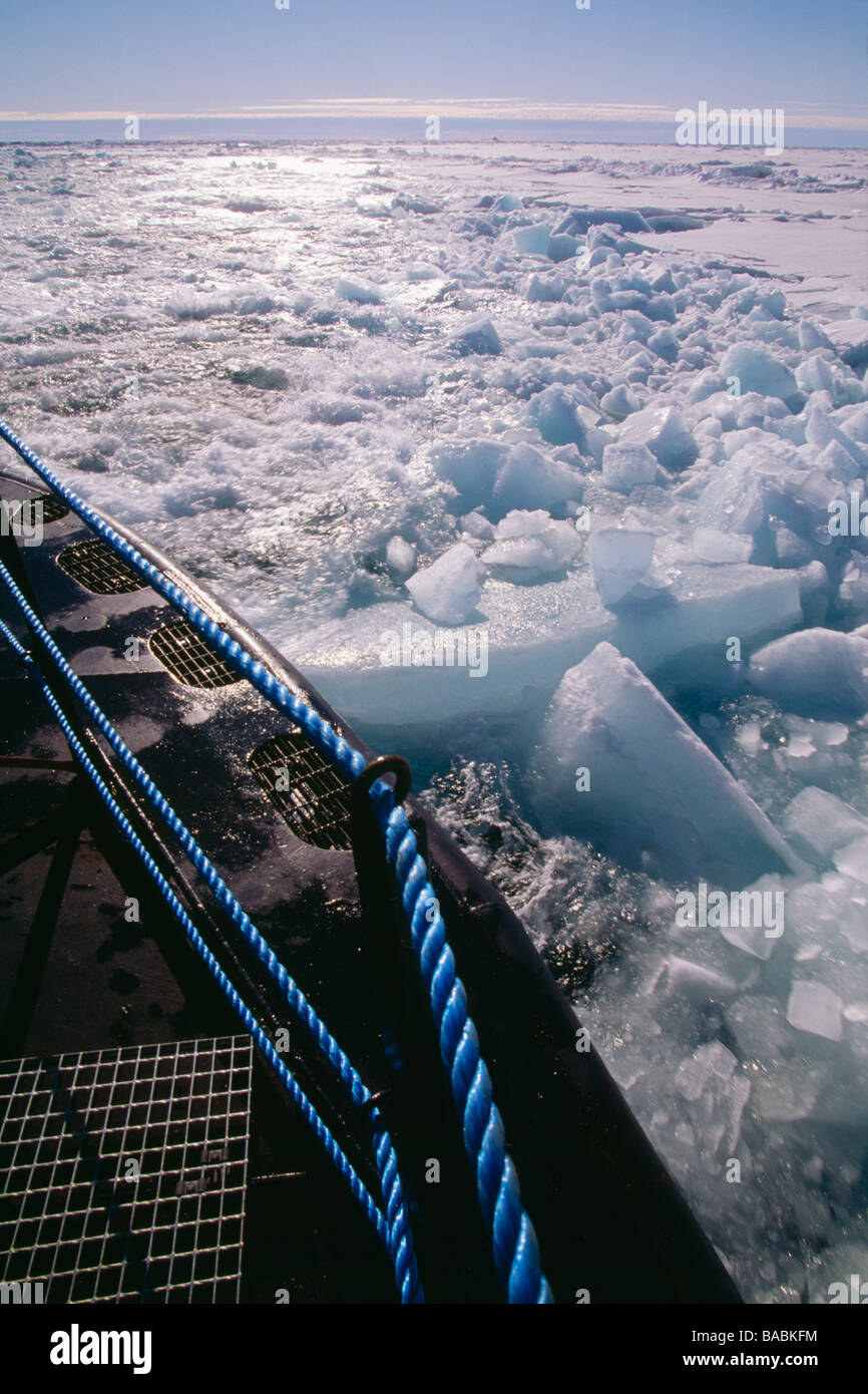 Boat floating through ice Stock Photo - Alamy