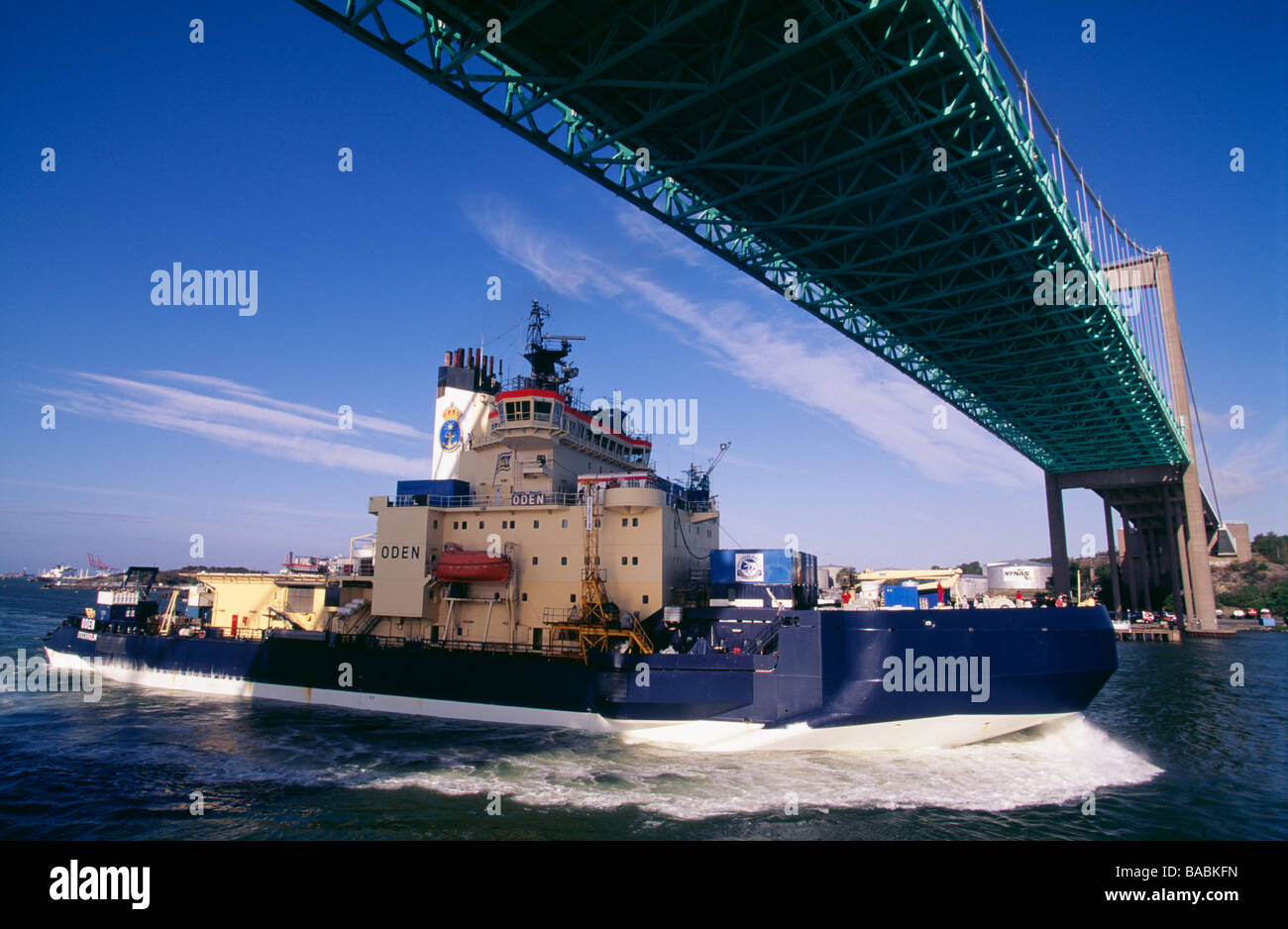 Ship passing under bridge Stock Photo - Alamy