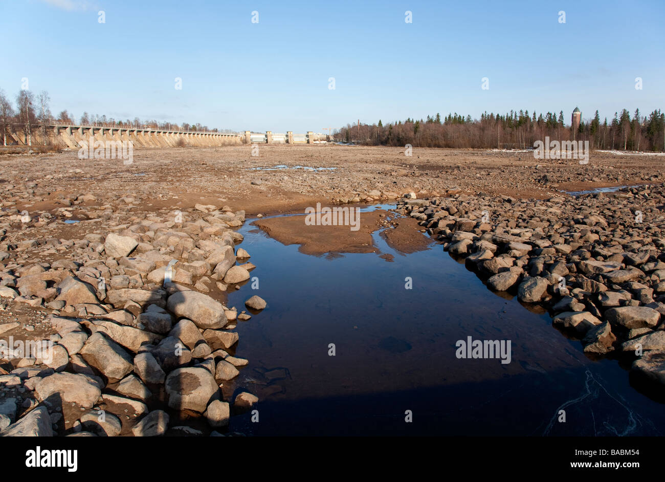 Dry riverbed behind the Merikoski power plant dam at River Oulujoki ...