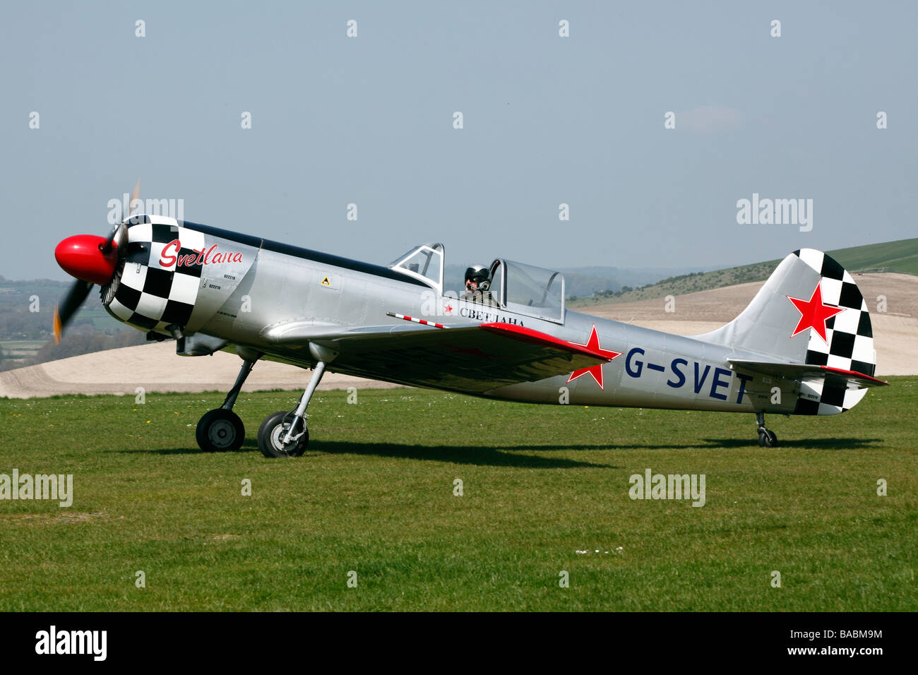A Yakovlev 50 flying at Compton Abbas airfield in Dorset in England ...