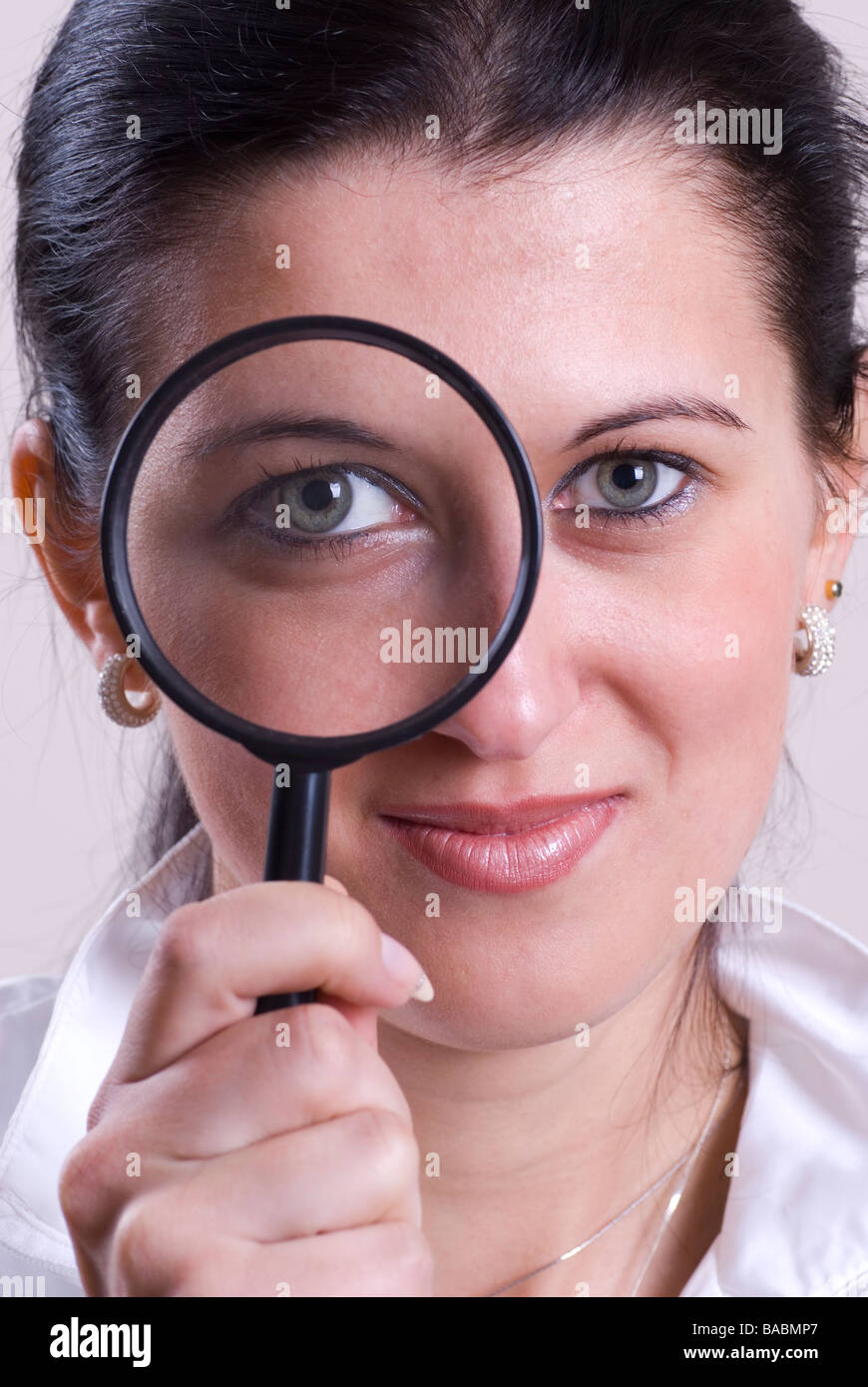 Girls looking through magnifying glass hi-res stock photography and ...