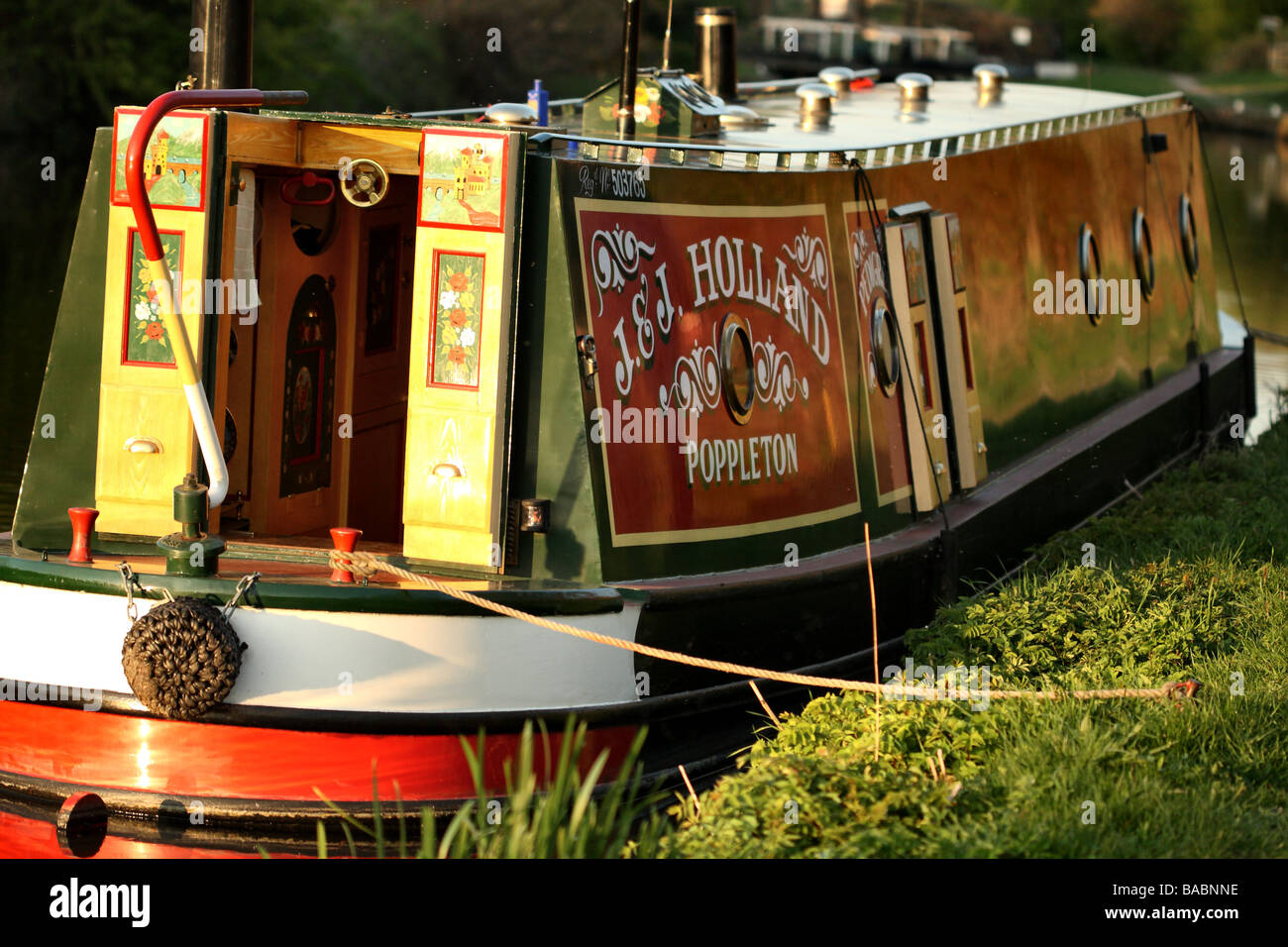 Colourful Canal Boat in late evening spring sunshine Stock Photo - Alamy