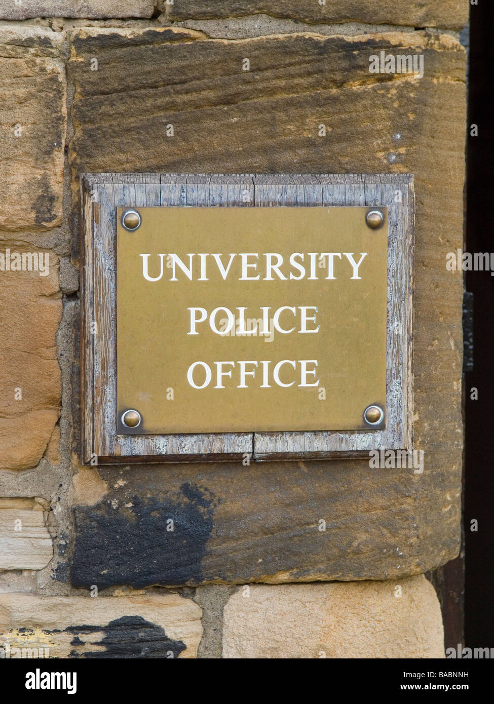 A brass plaque at the entrance of the 'University Police Office' in ...