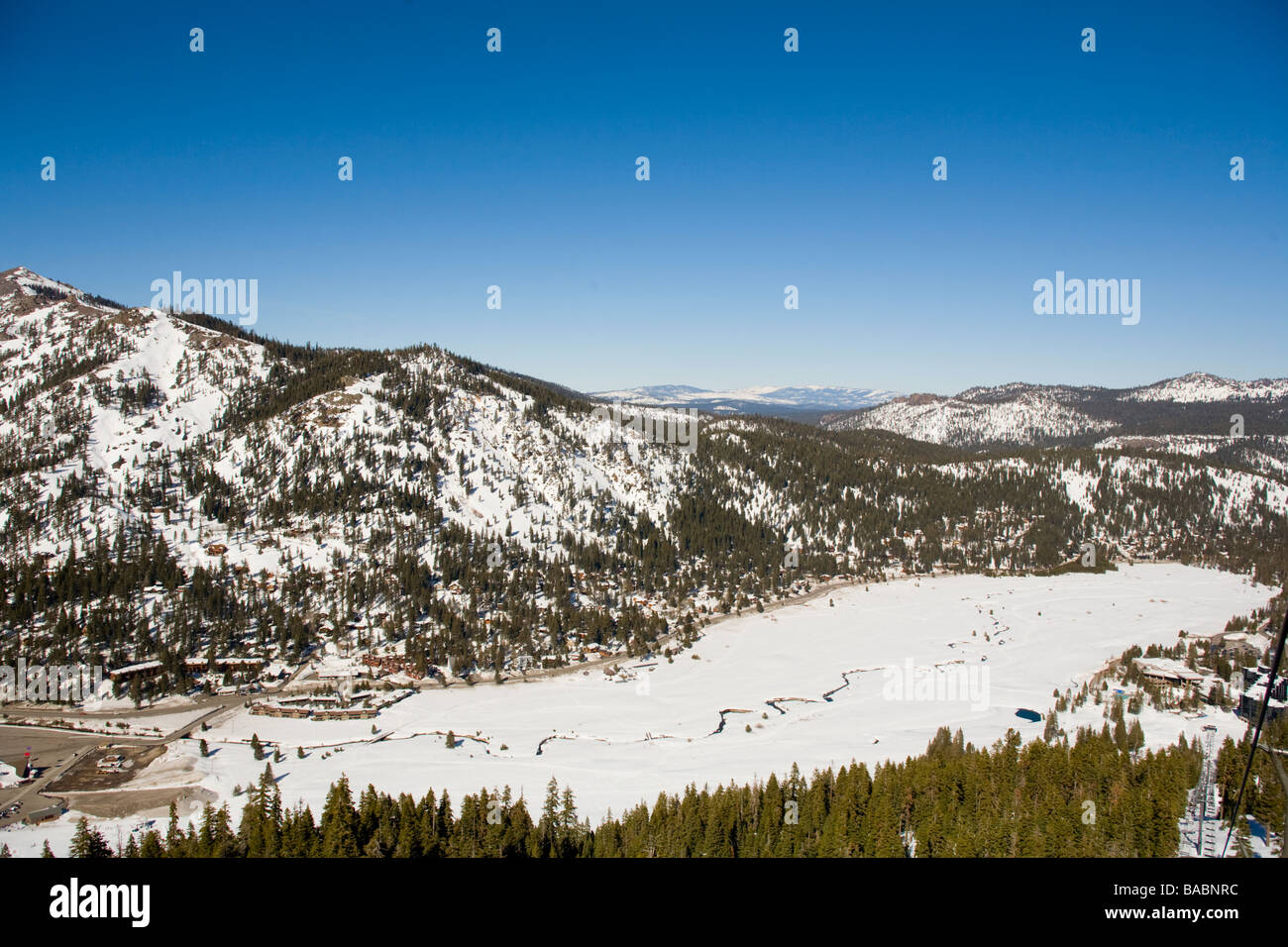 Olympic Valley, California; view of Squaw Creek amid snow from above ...