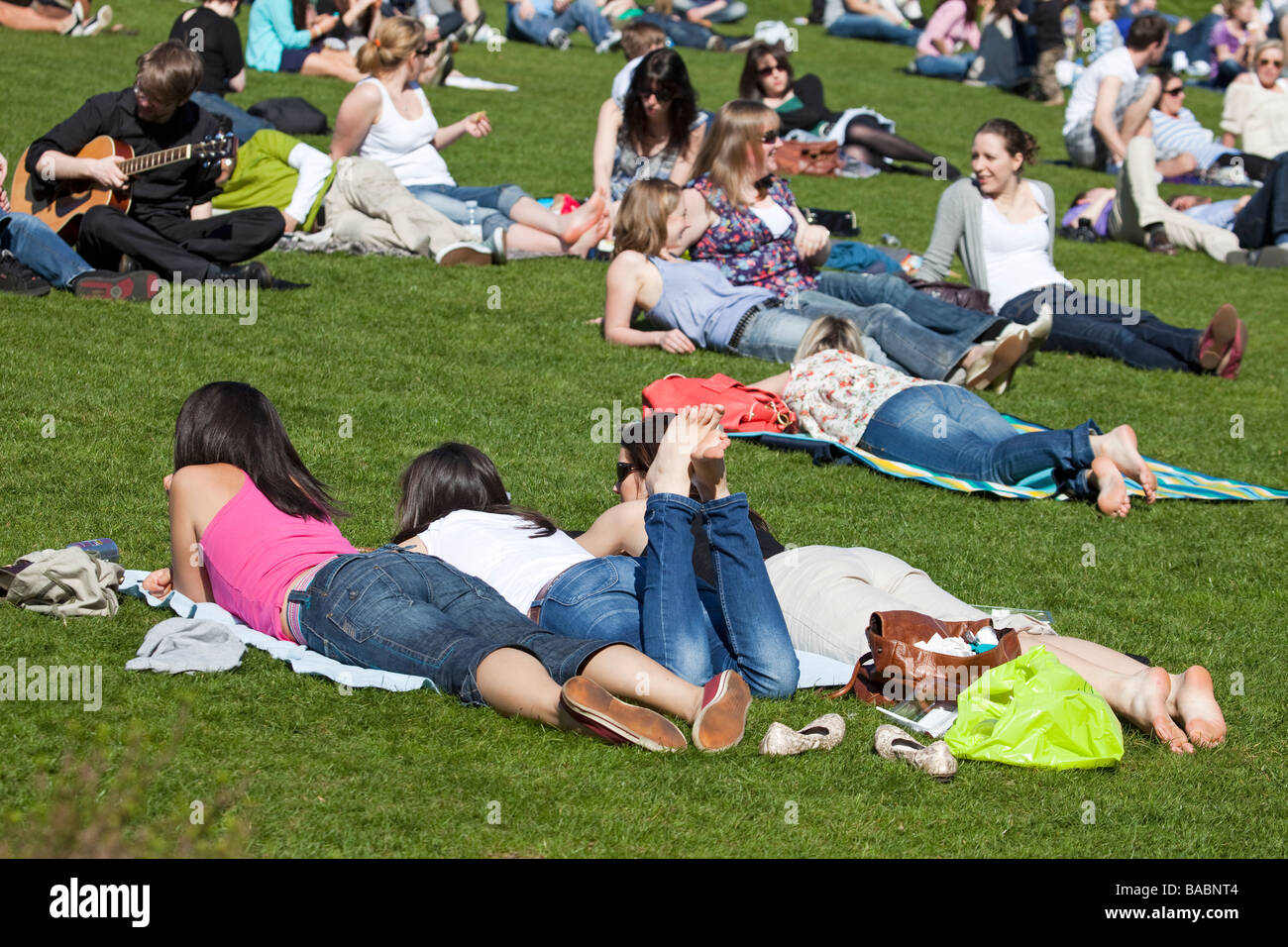 Groups of young people enjoying a sunny day in Glasgow's Botanic ...