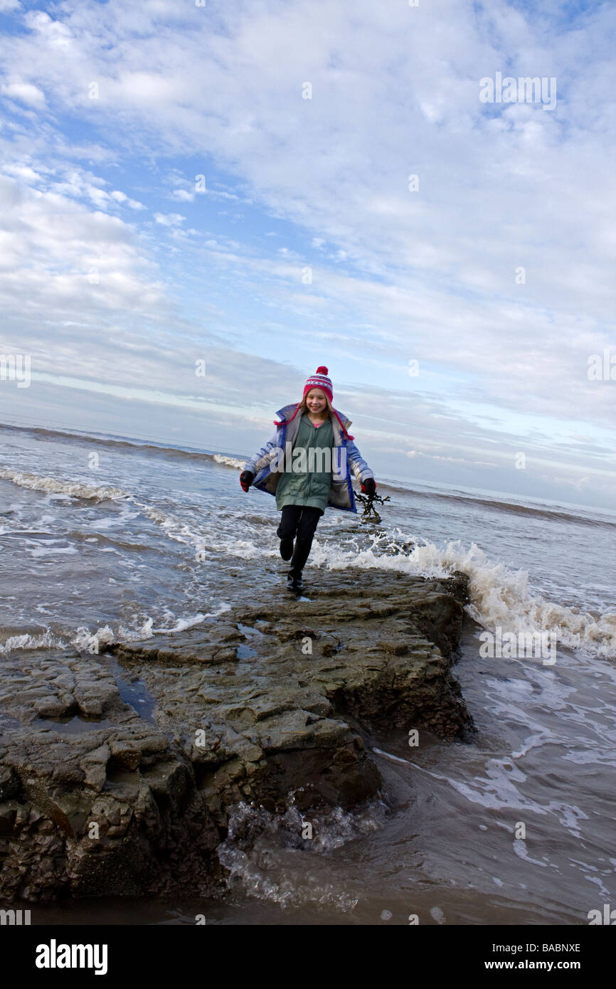 Girl running from waves hi-res stock photography and images - Alamy