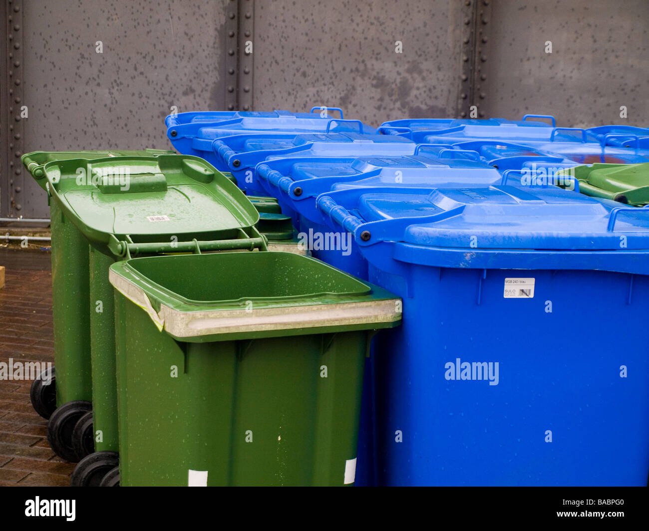Blue and Green Plastic Trash Garbage Can Bins Stock Photo - Alamy