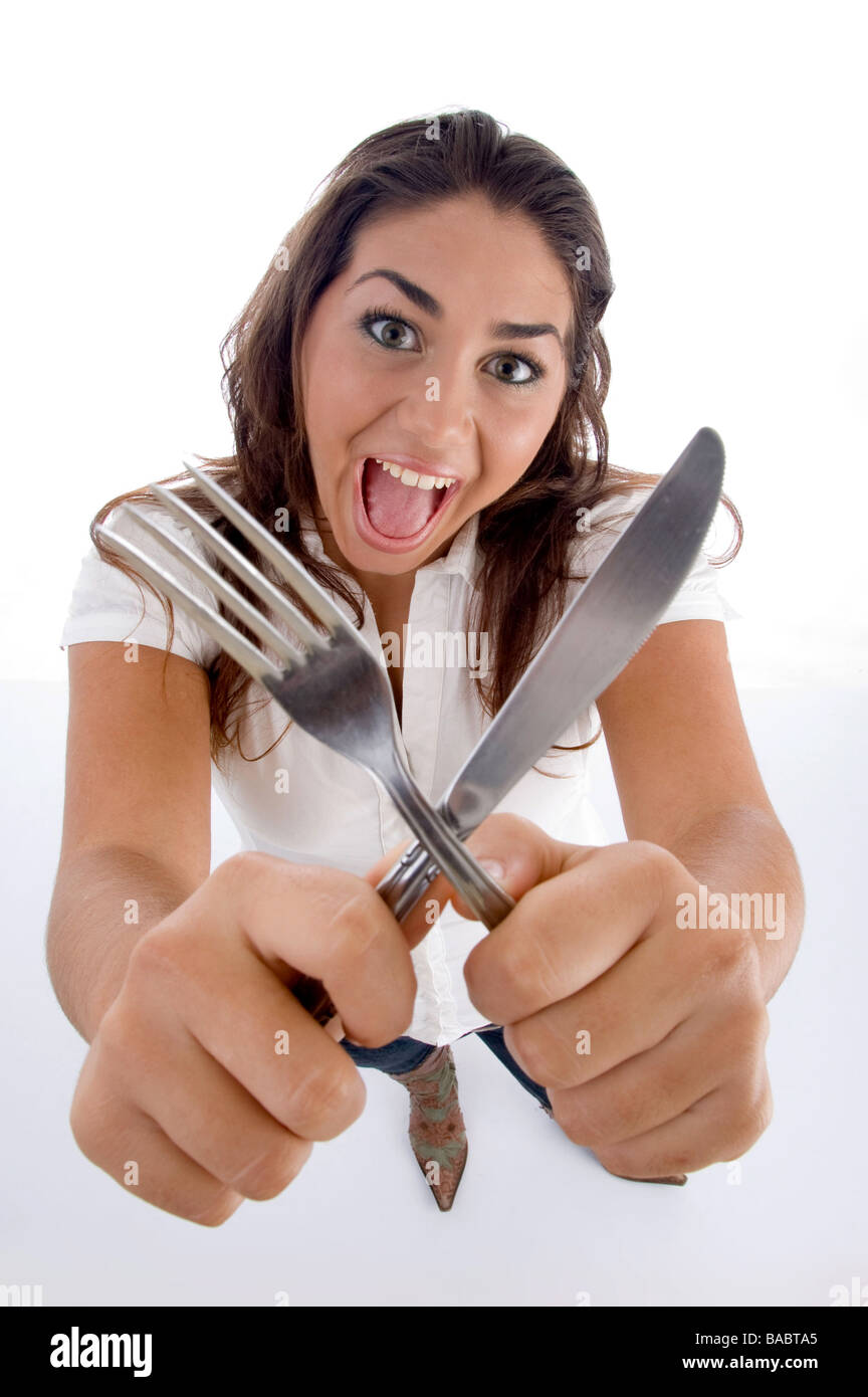cute teenager showing cutlery Stock Photo - Alamy