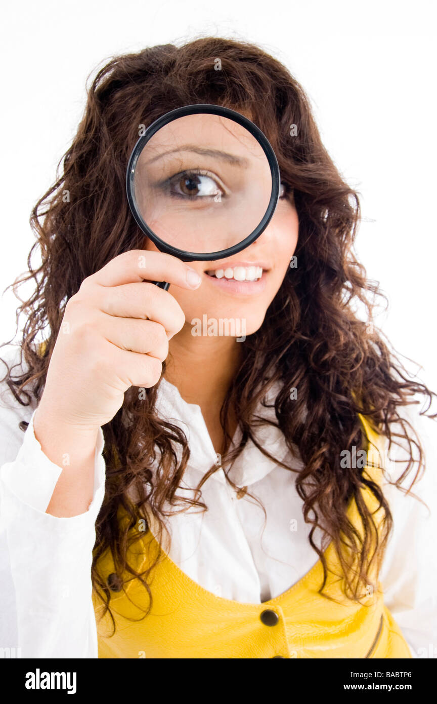 young girl holding magnifier and showing her magnified eye Stock Photo ...