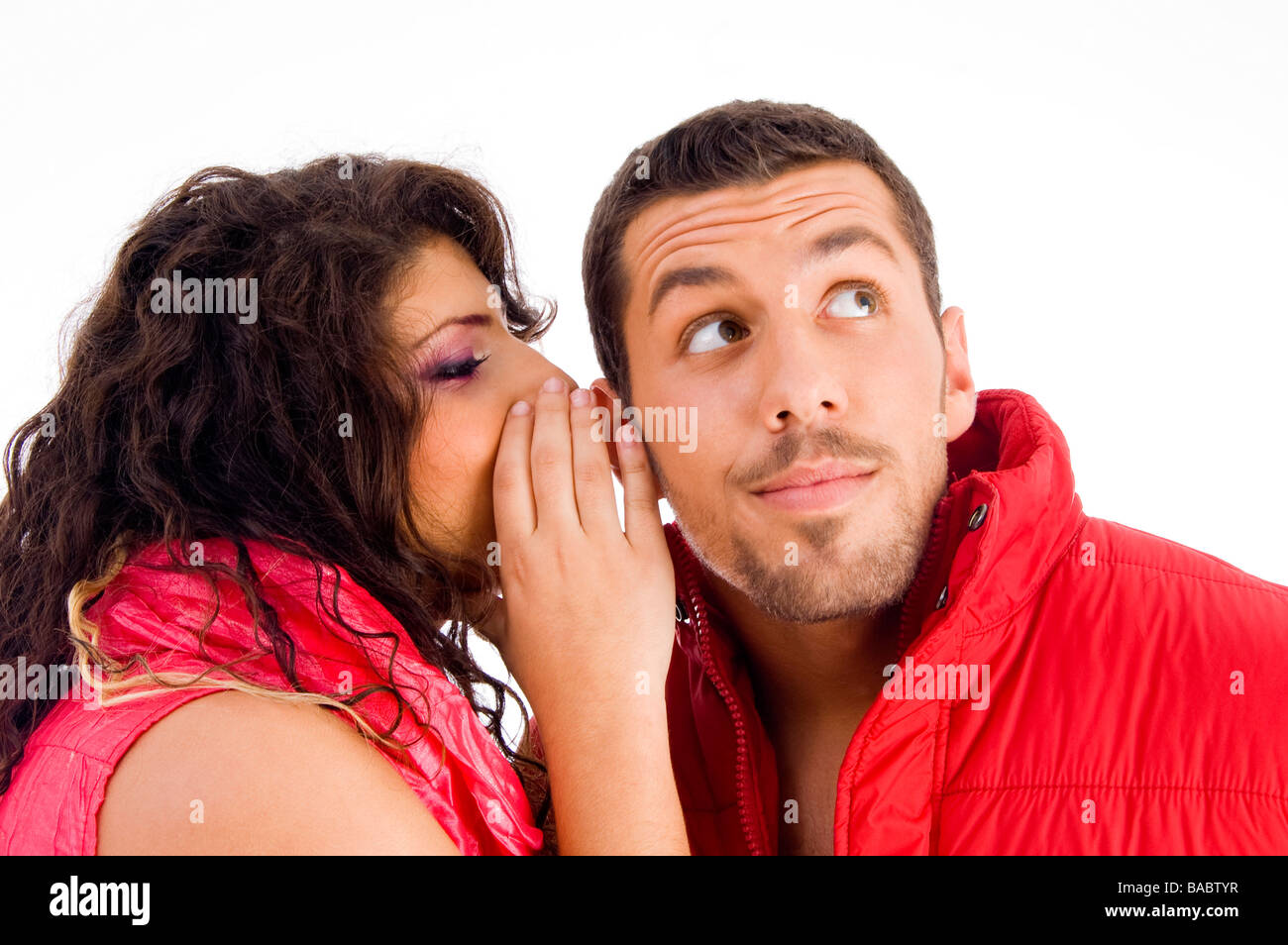 loving caucasian pair whispering a secret Stock Photo - Alamy