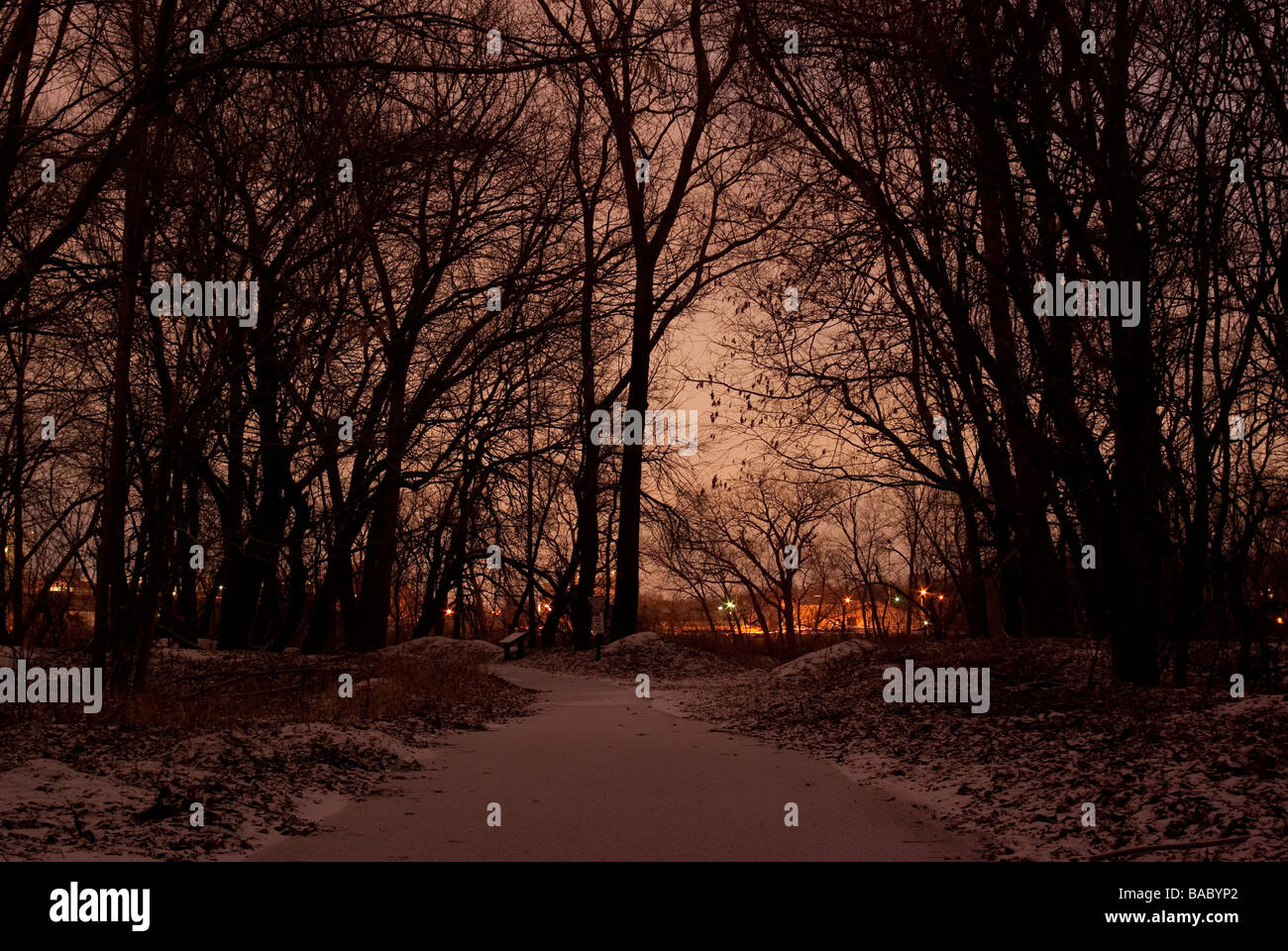 Snow gathers on a public walking trail at Sunset Stock Photo - Alamy