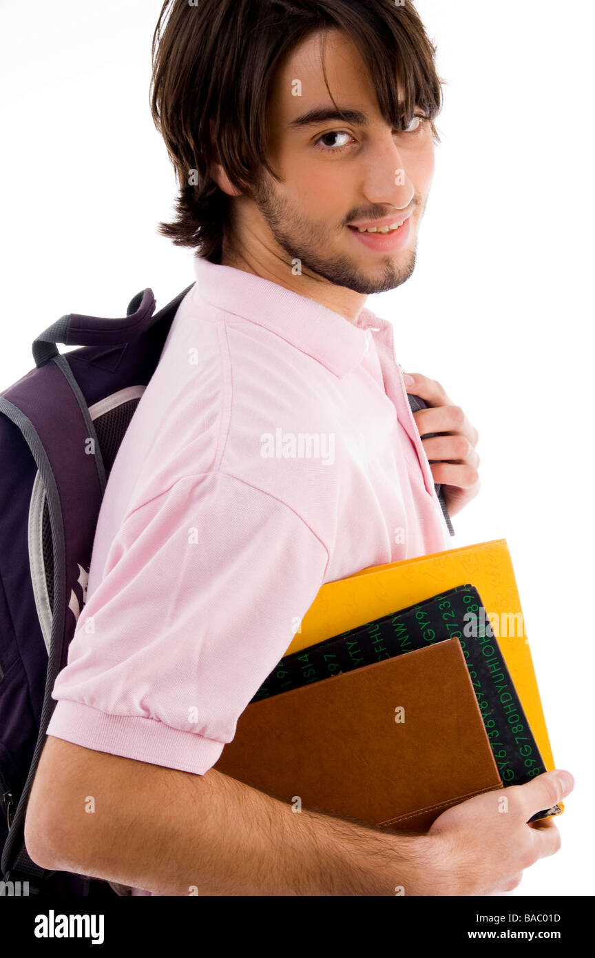 smiling college boy posing with his bag and books Stock Photo - Alamy