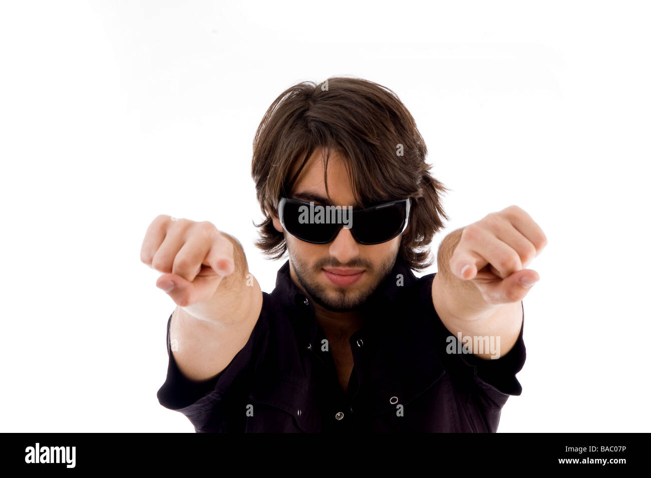 handsome male pointing with both hands Stock Photo - Alamy