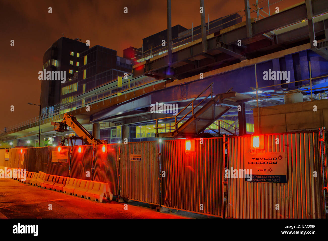 Night shot of construction on DLR line at South Quay Stock Photo - Alamy