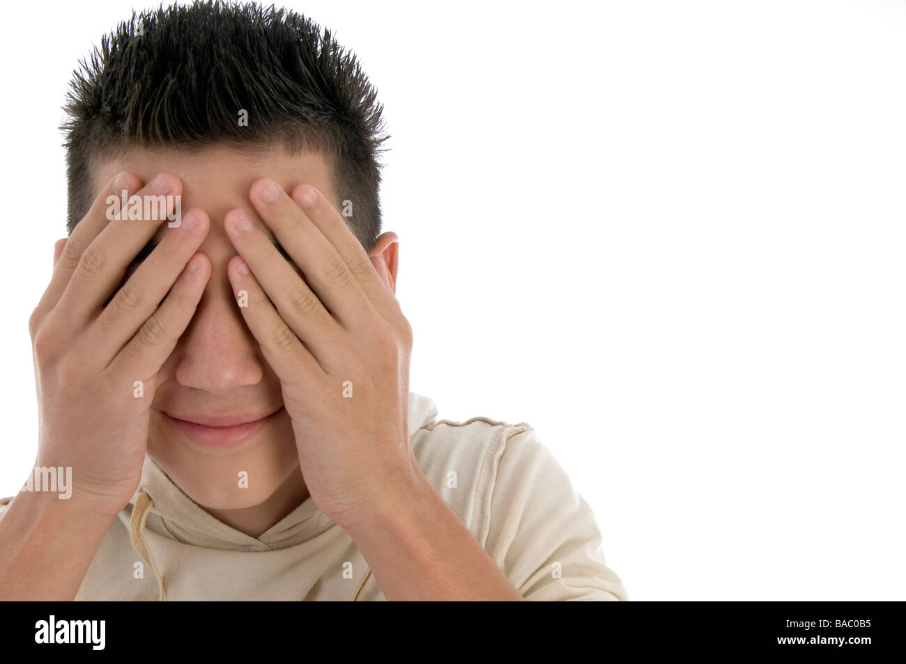 portrait of boy hiding his face Stock Photo - Alamy