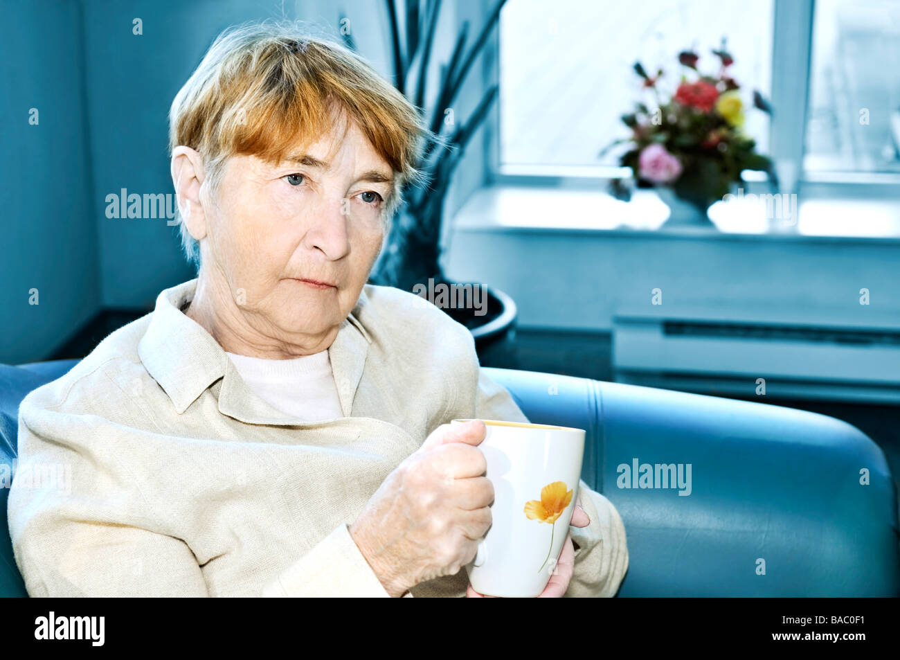 Lonely sad woman drinking tea hi-res stock photography and images - Alamy