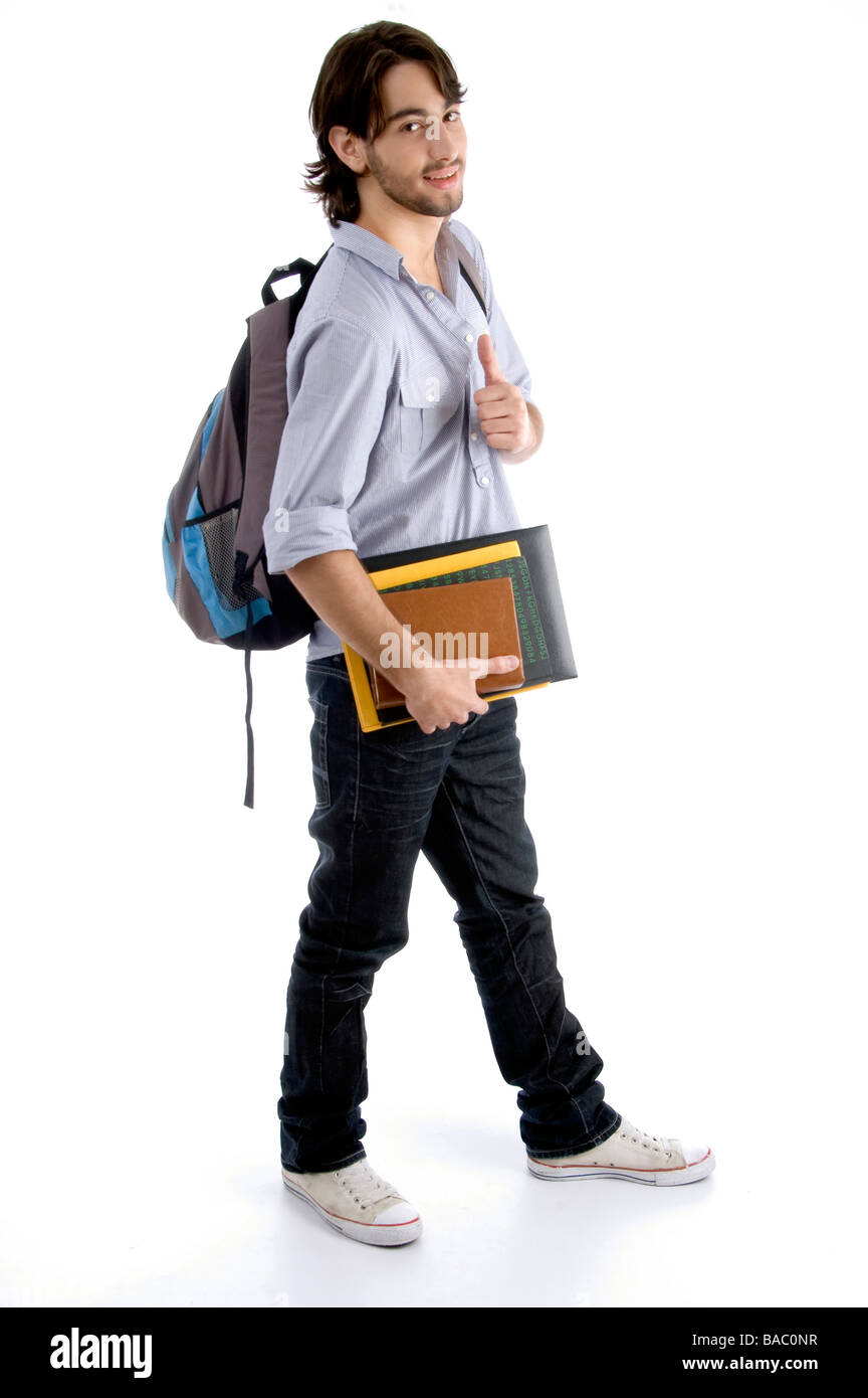 full body pose of student holding his books Stock Photo - Alamy