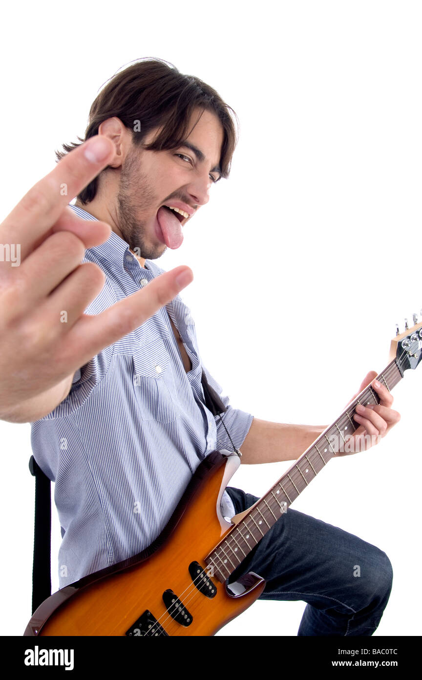 young rock star posing with guitar Stock Photo - Alamy