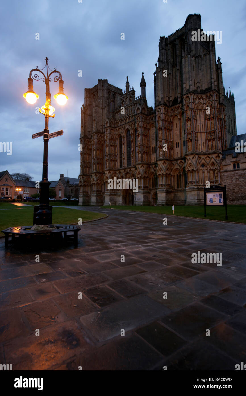 City of Wells, England. Night view of the West Front and Nave entrance ...